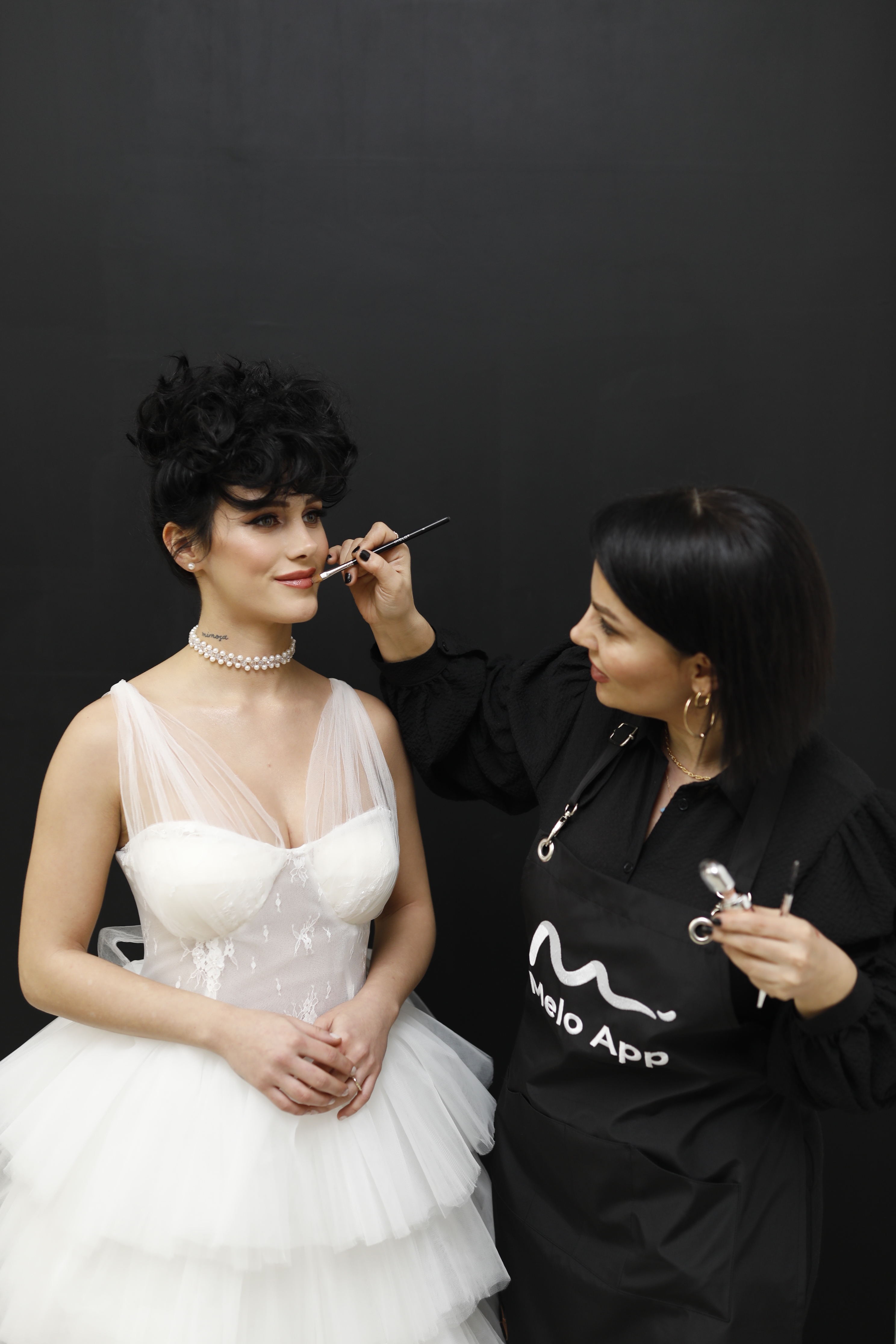 Bridal makeup offered by Melo App is performed with a professional ...